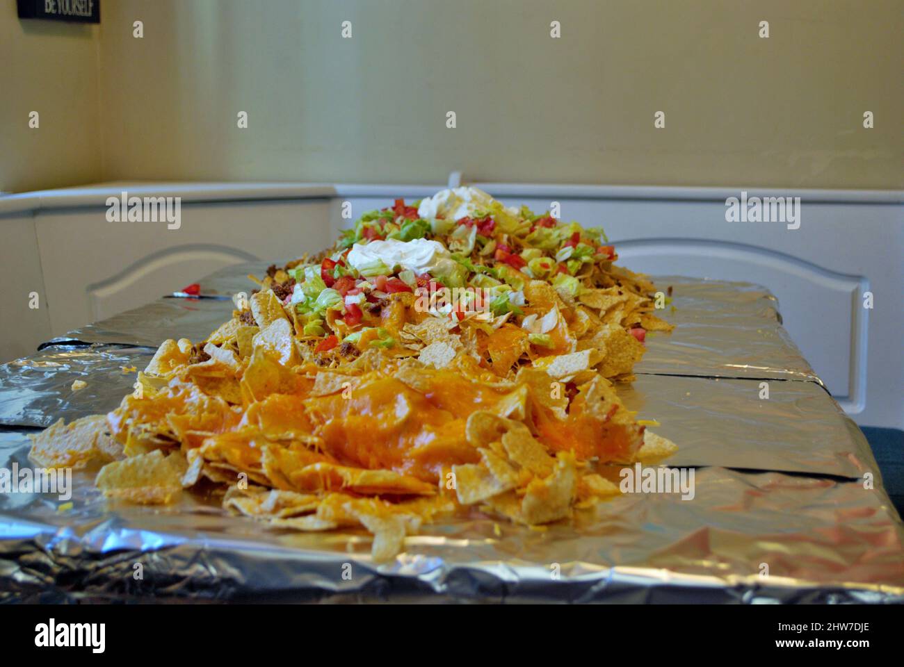 Nacho table kitchen table wrapped in aluminum foil and covered with ...