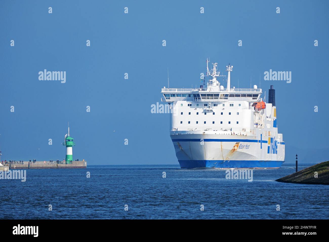 Lubeck, Germany, March 3, 2022: Large ferry boat between the lighthouse ...