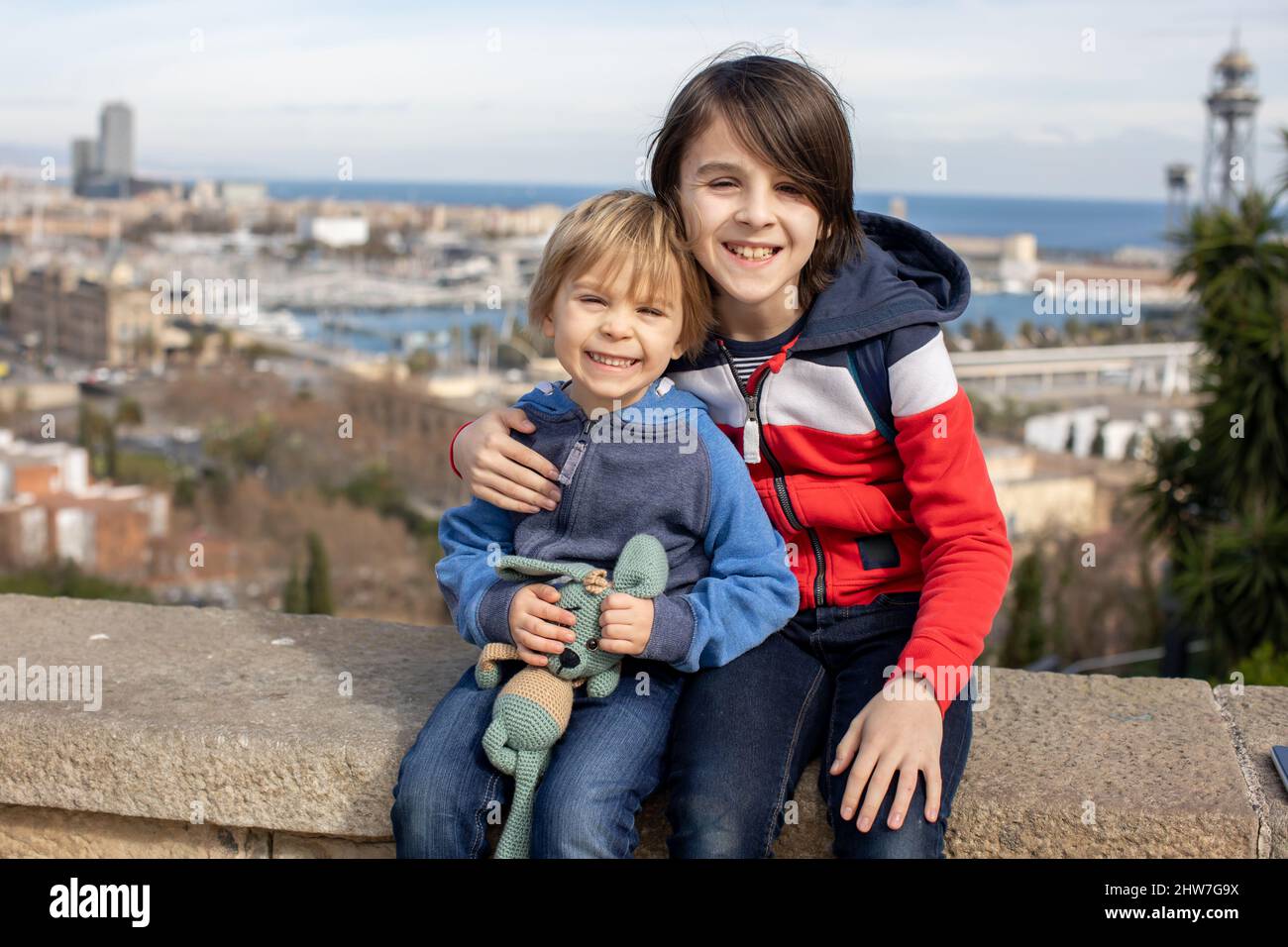 Cute little children tourists admiring Barcelona city, family travel ...