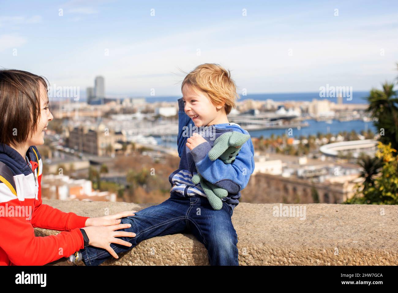 Cute little children tourists admiring Barcelona city, family travel ...