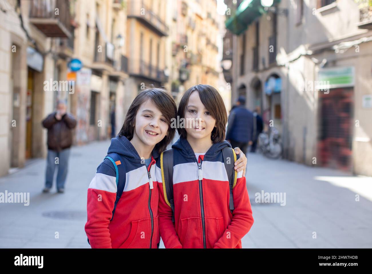 Cute little children tourists admiring Barcelona city, family travel ...
