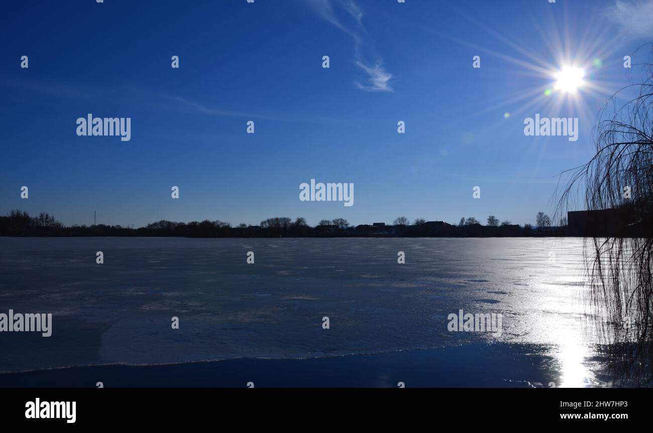 Lake and sun Stock Photo - Alamy