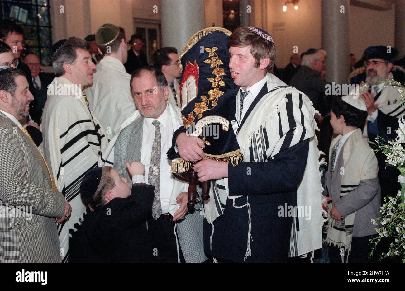 Rabbi Adam Hill with the new Sefer. The new Sefer Torah is honoured by ...