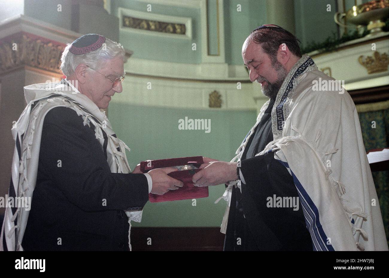 Senior minister of the synagogue is presented with a memento Sefer to ...