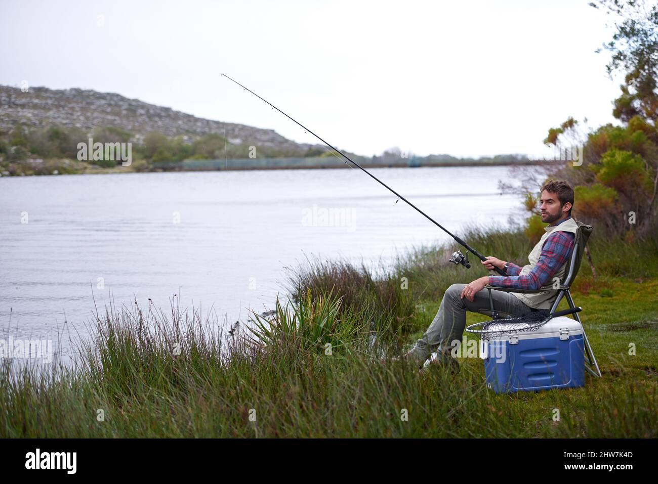 Handsome young fisherman hi-res stock photography and images - Alamy