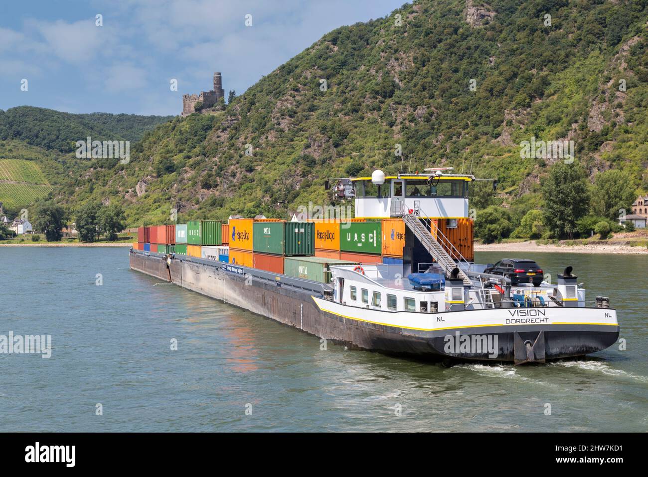Rhine River Valley, Germany. Boat Carrying Container Cargo Approaching ...
