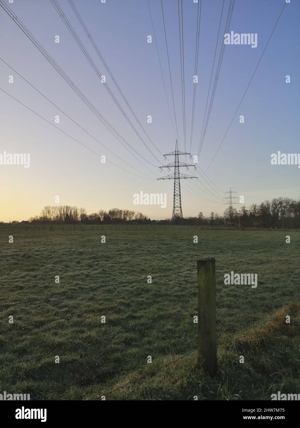 Overhead power line over a rural area Stock Photo - Alamy