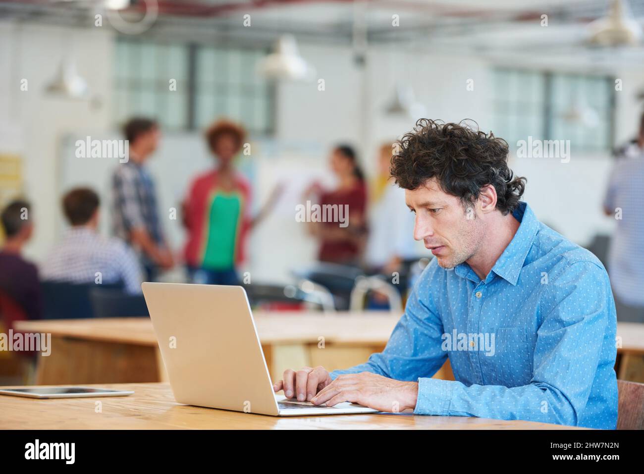 Finalizing his presentation. Cropped shot of a handsome businessman ...