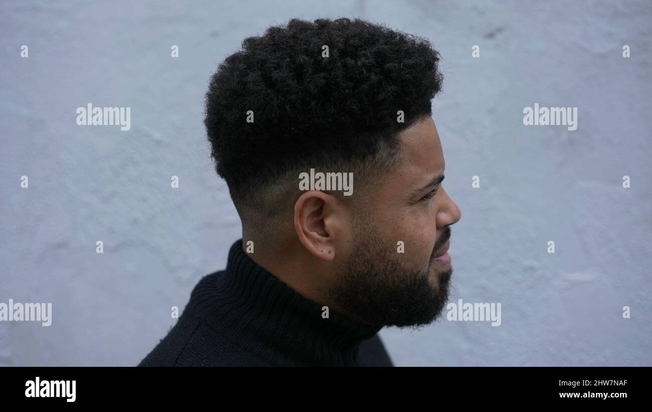 A pensive black man in solitude outside thoughtful person Stock Photo ...