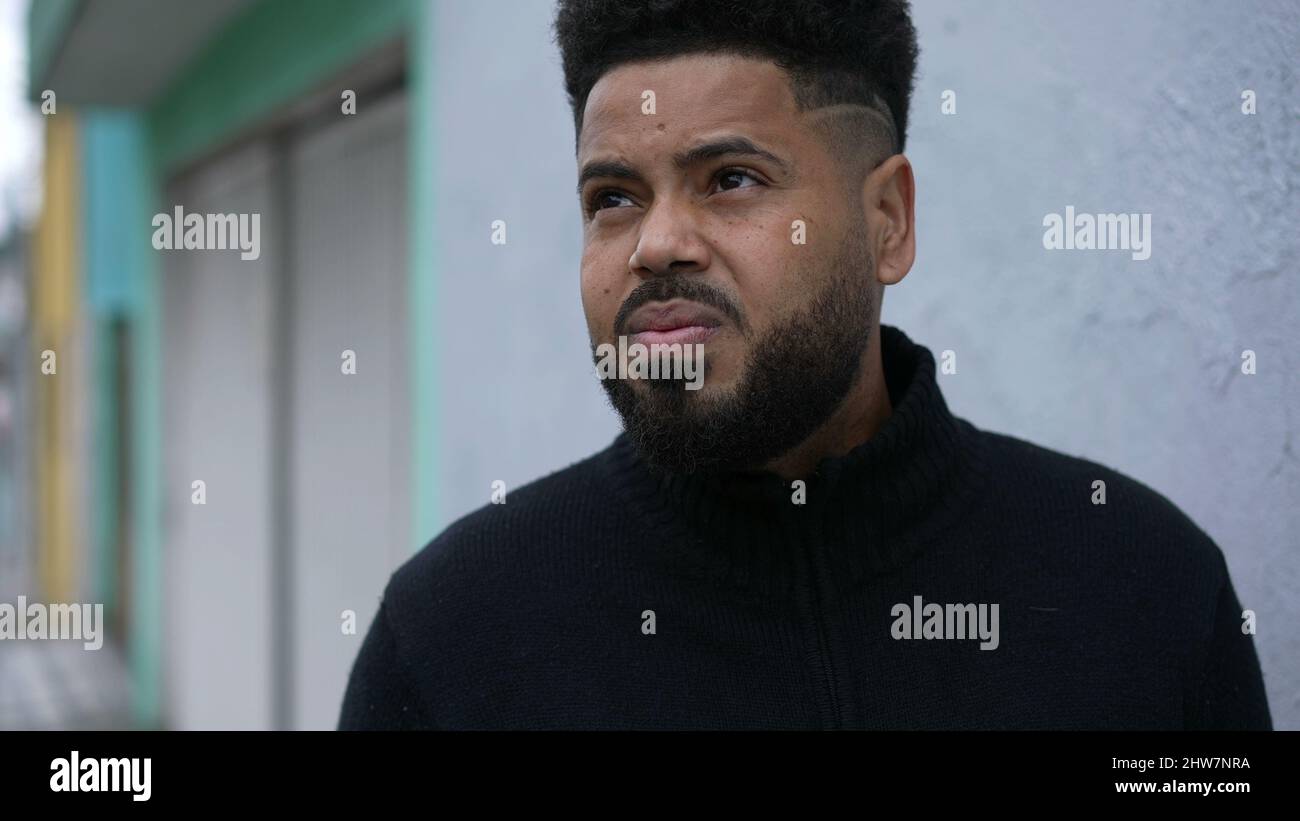 One pensive brazilian man standing hi-res stock photography and images ...