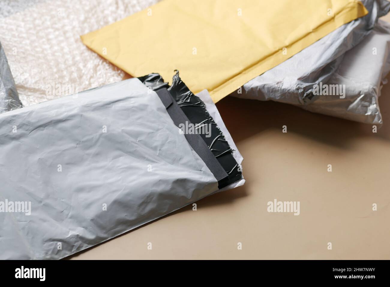 close up of delivery packages on color background Stock Photo - Alamy