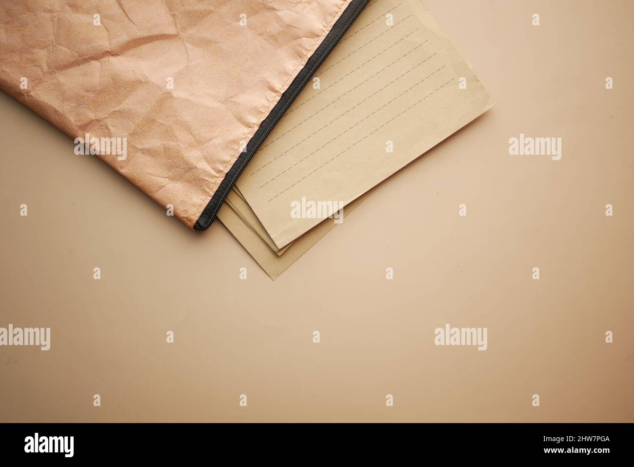 putting paper in a bag on table Stock Photo - Alamy