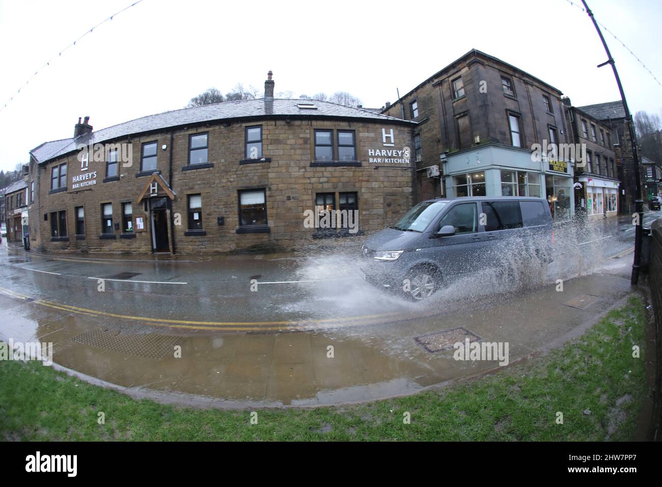 Traffic struggles, through flood water in Holmfirth, West Yorkshire ...