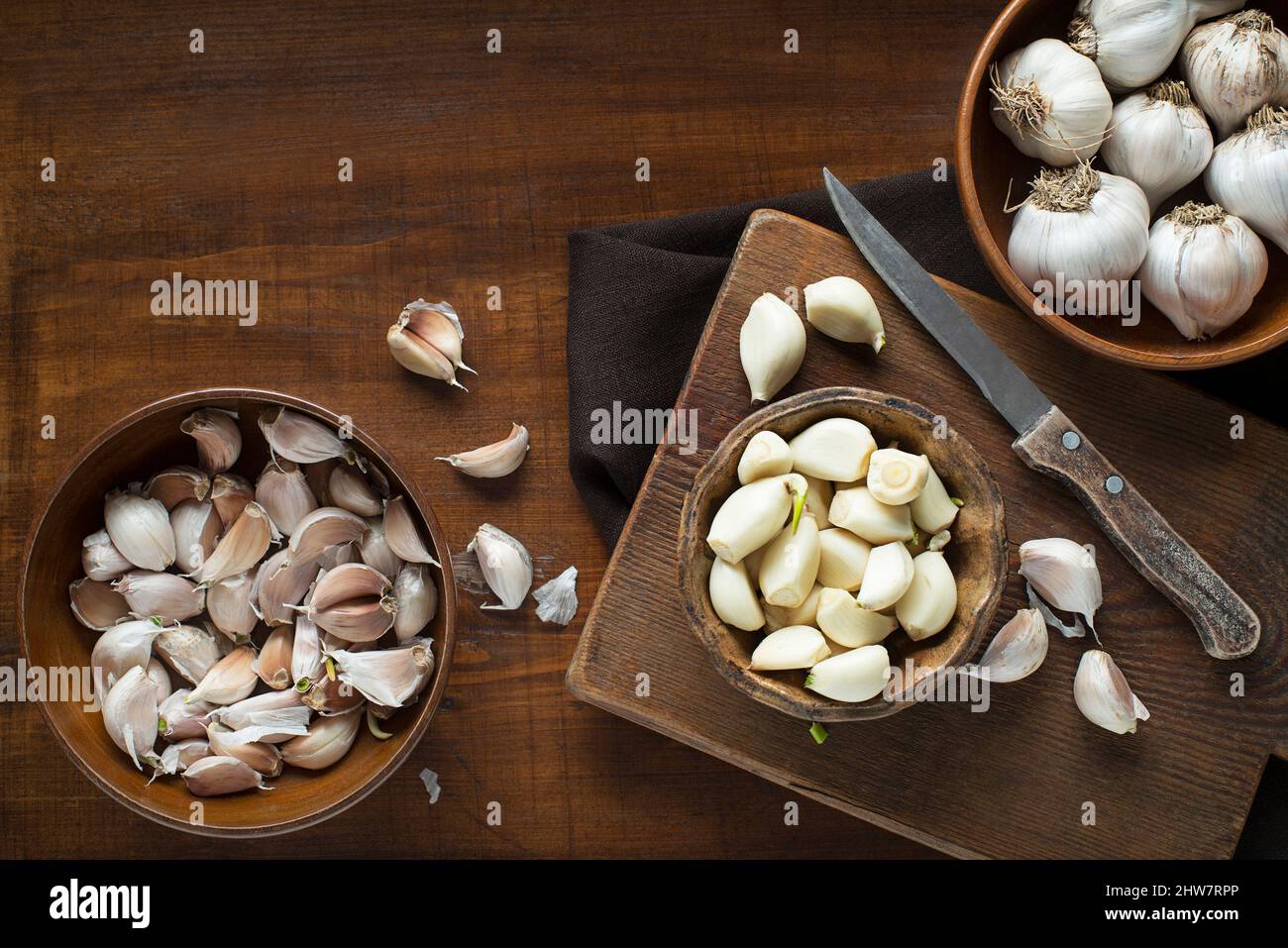 Garlic cloves on wooden vintage background. Garlic cooking Stock Photo ...