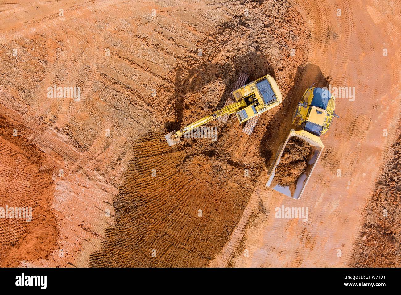 Excavation and loading onto dump trucks with excavators work ...