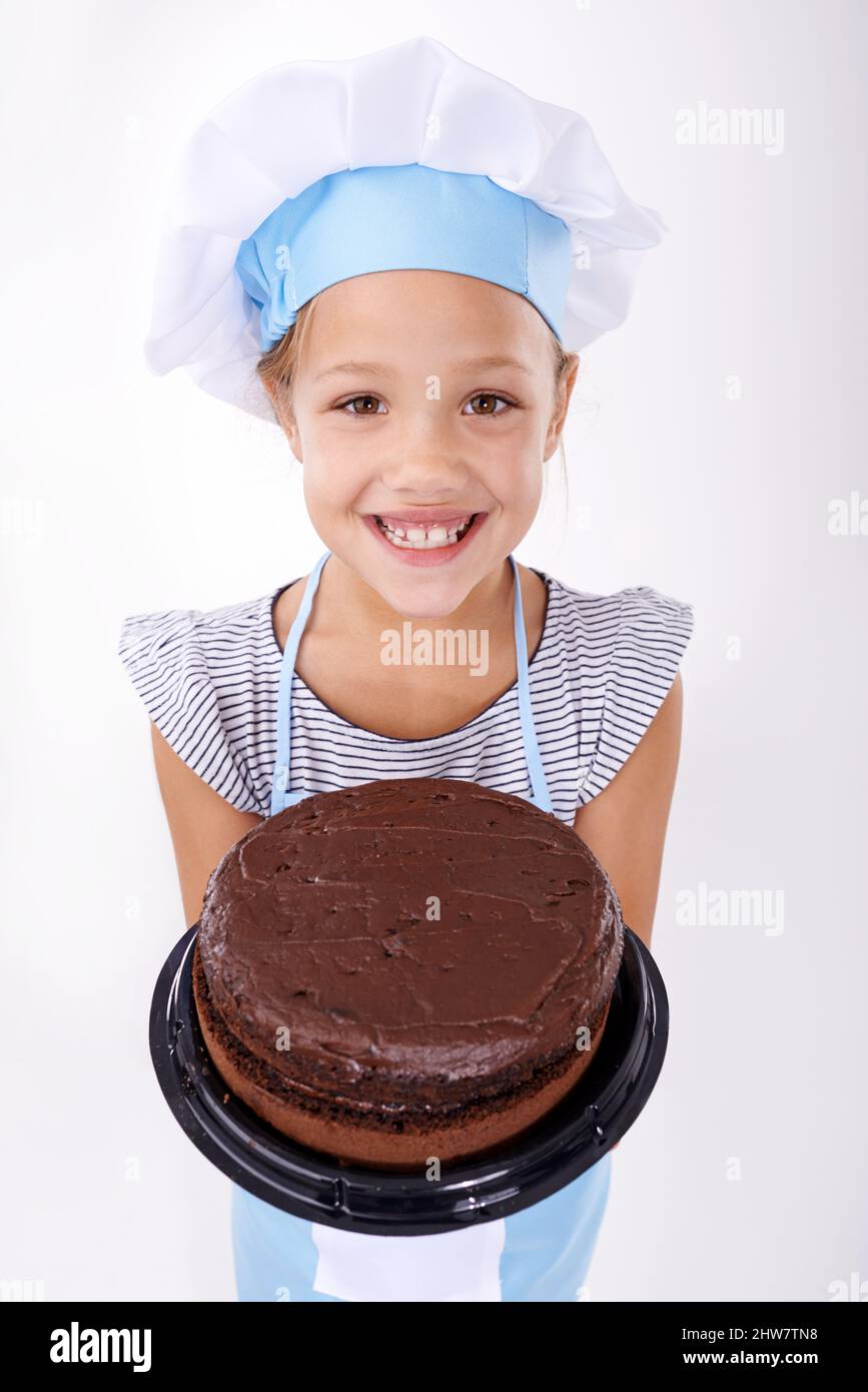 This is more delicious than it looks. Studio shot of a cute young girl ...