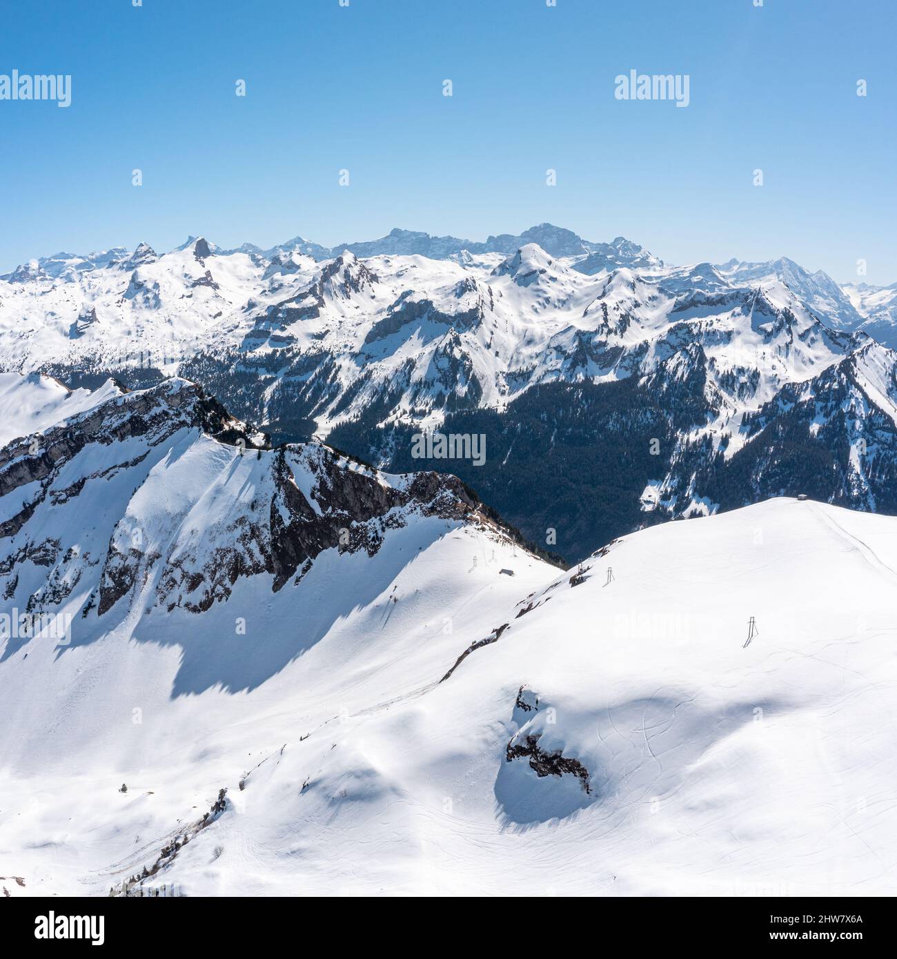 Winter in the Alps. Snow on the tops of the mountains. Skiers' tracks ...