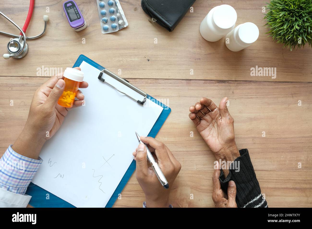 doctor giving a medical pill container his senior patient Stock Photo ...