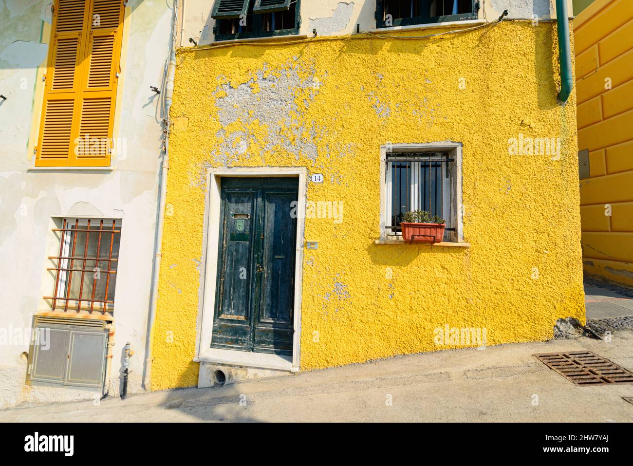Traditional colors of the house, walls, doors, windows. Italy Stock ...