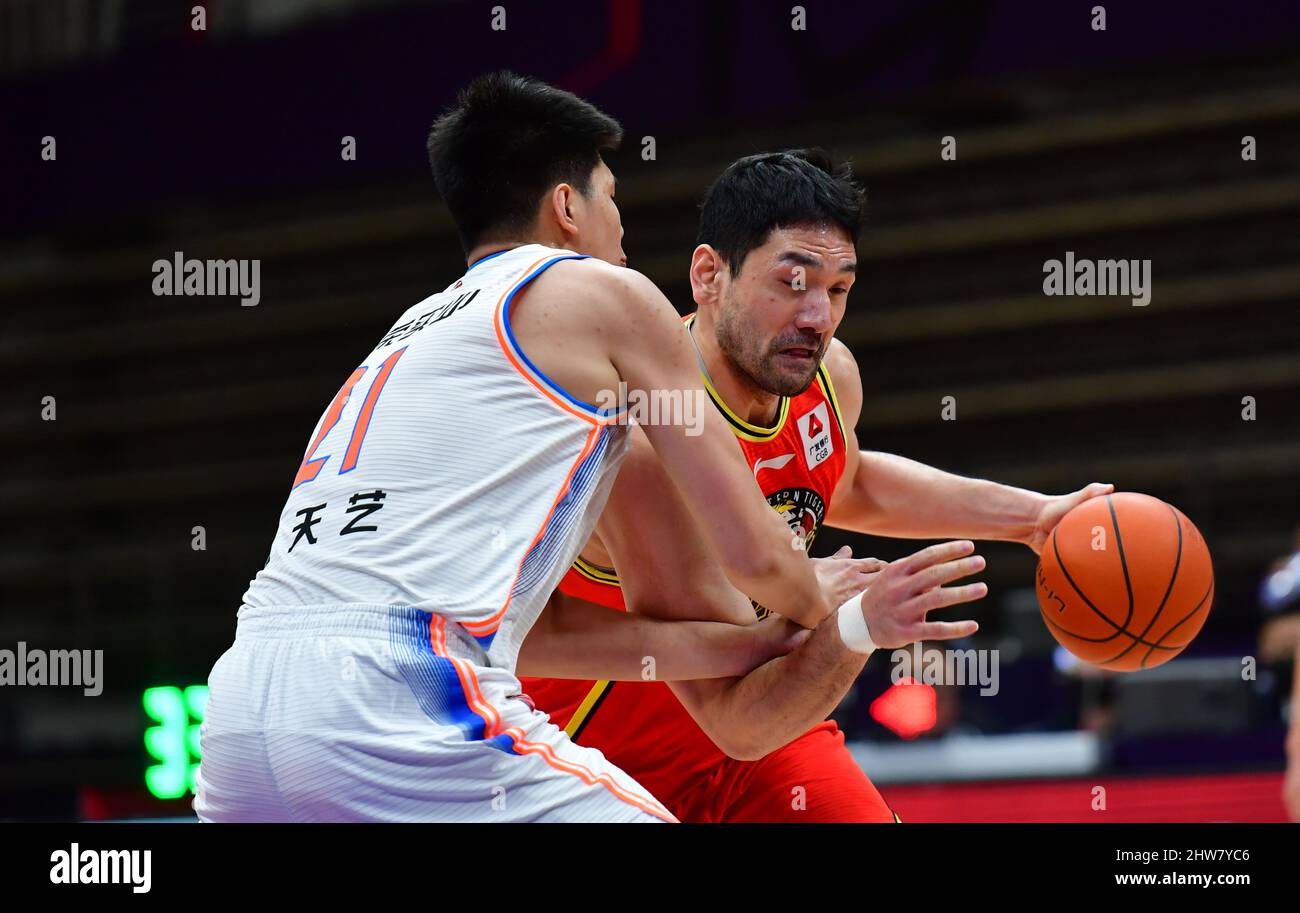 Shenyang. 4th Mar, 2022. Zhong Cheng (R) of Jilin Northeast Tigers ...