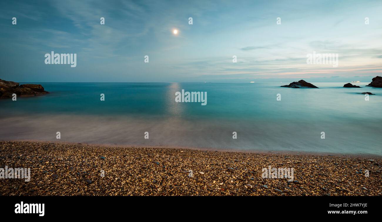 Sea at Night. Cinema filter. Mediterranean coast. Pebbles on the beach ...