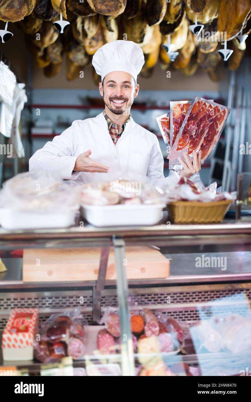 young man seller showing sliced bacon in shop Stock Photo - Alamy young man seller showing sliced bacon in shop Stock Photo - Alamy