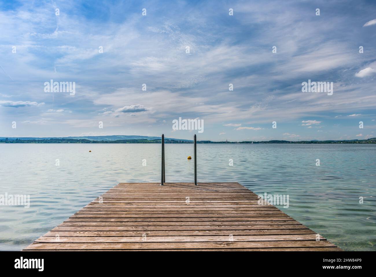 Wooden pier on the lake. Landscape for self-reflection. Switzerland ...