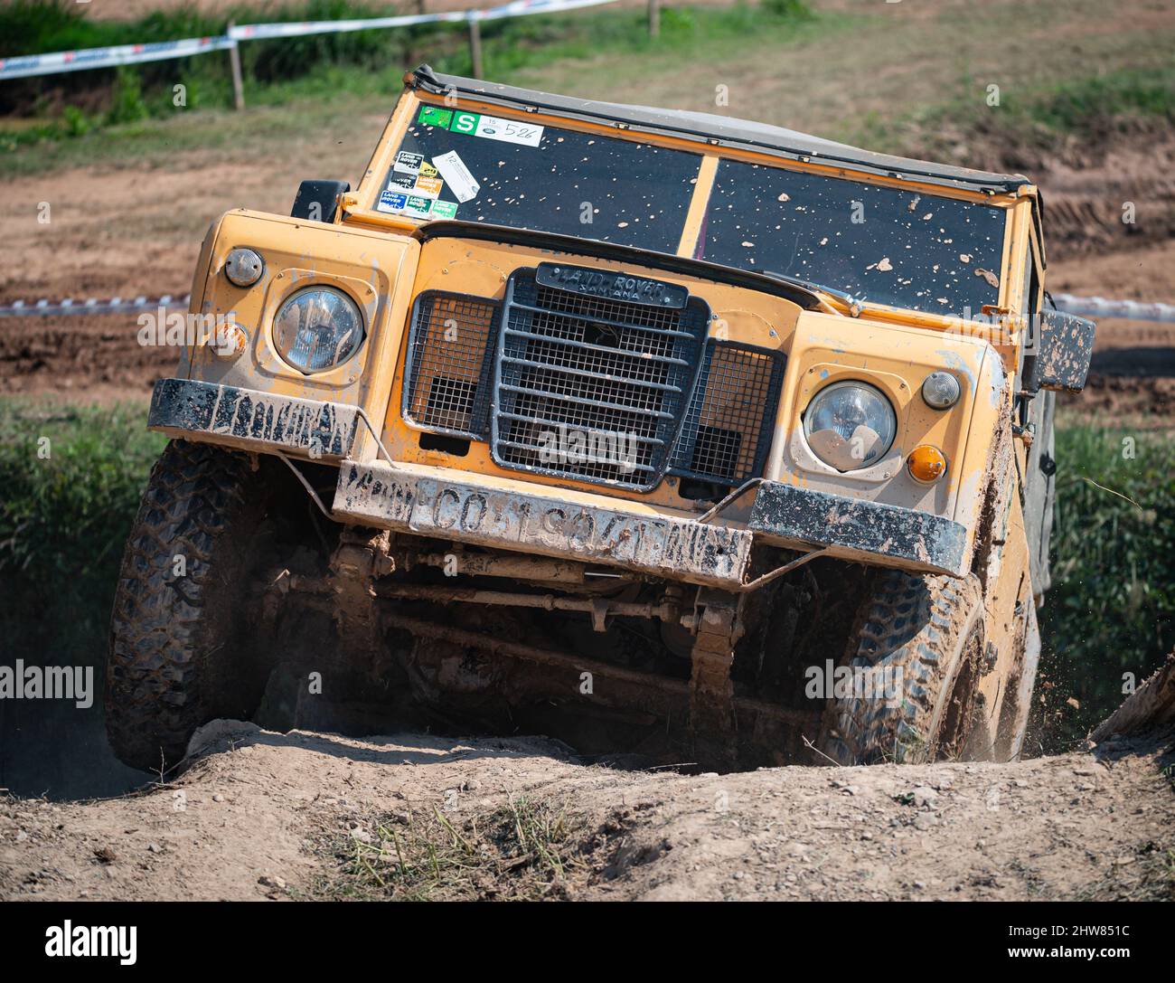 Photo of an old yellow Land Rover Santana Series three rock crawling ...