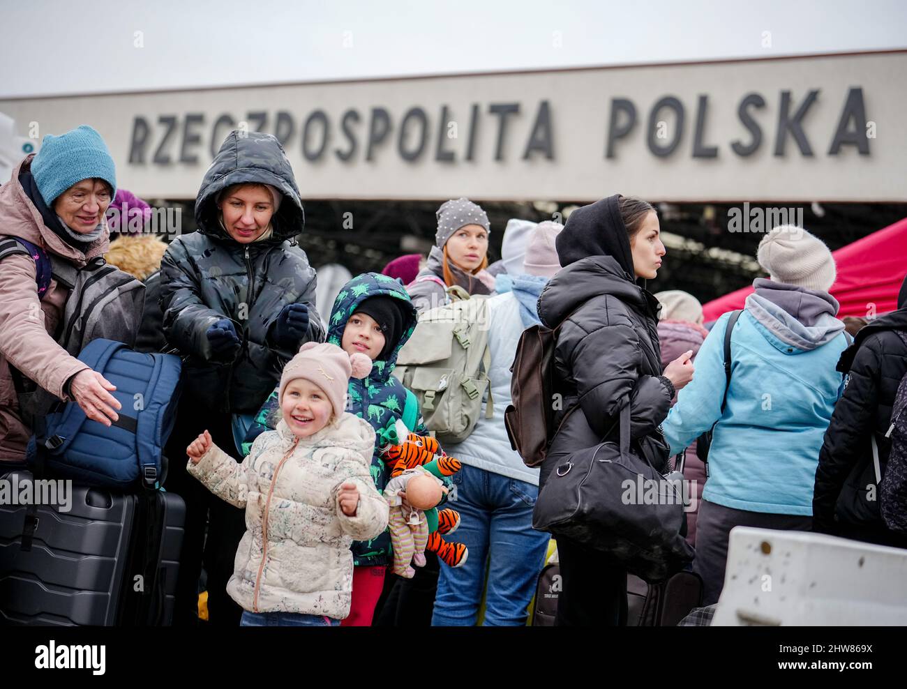 Korczowa, Poland. 04th Mar, 2022. Refugees stand at the Ukrainian ...