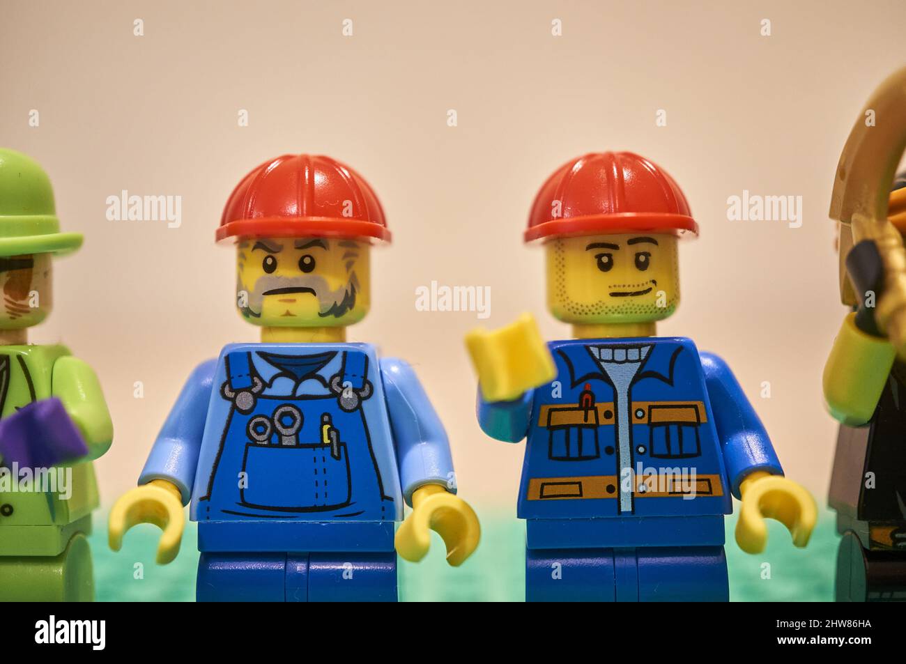 Closeup of two Lego construction workers wearing red helmets Stock ...