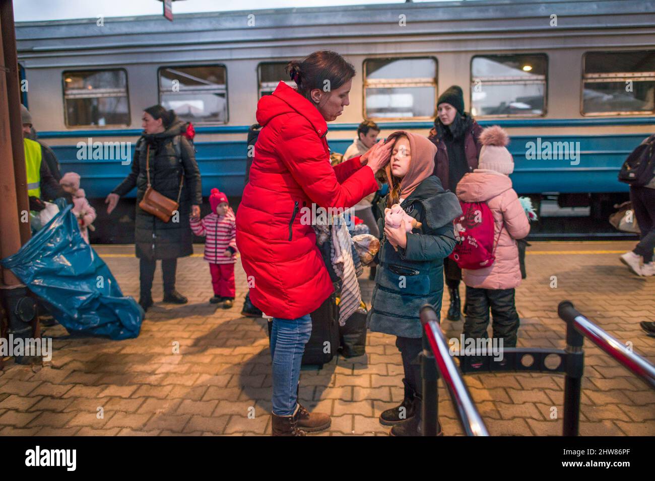 Ukrainian refugees are seen disembarked from a train that arrived from ...