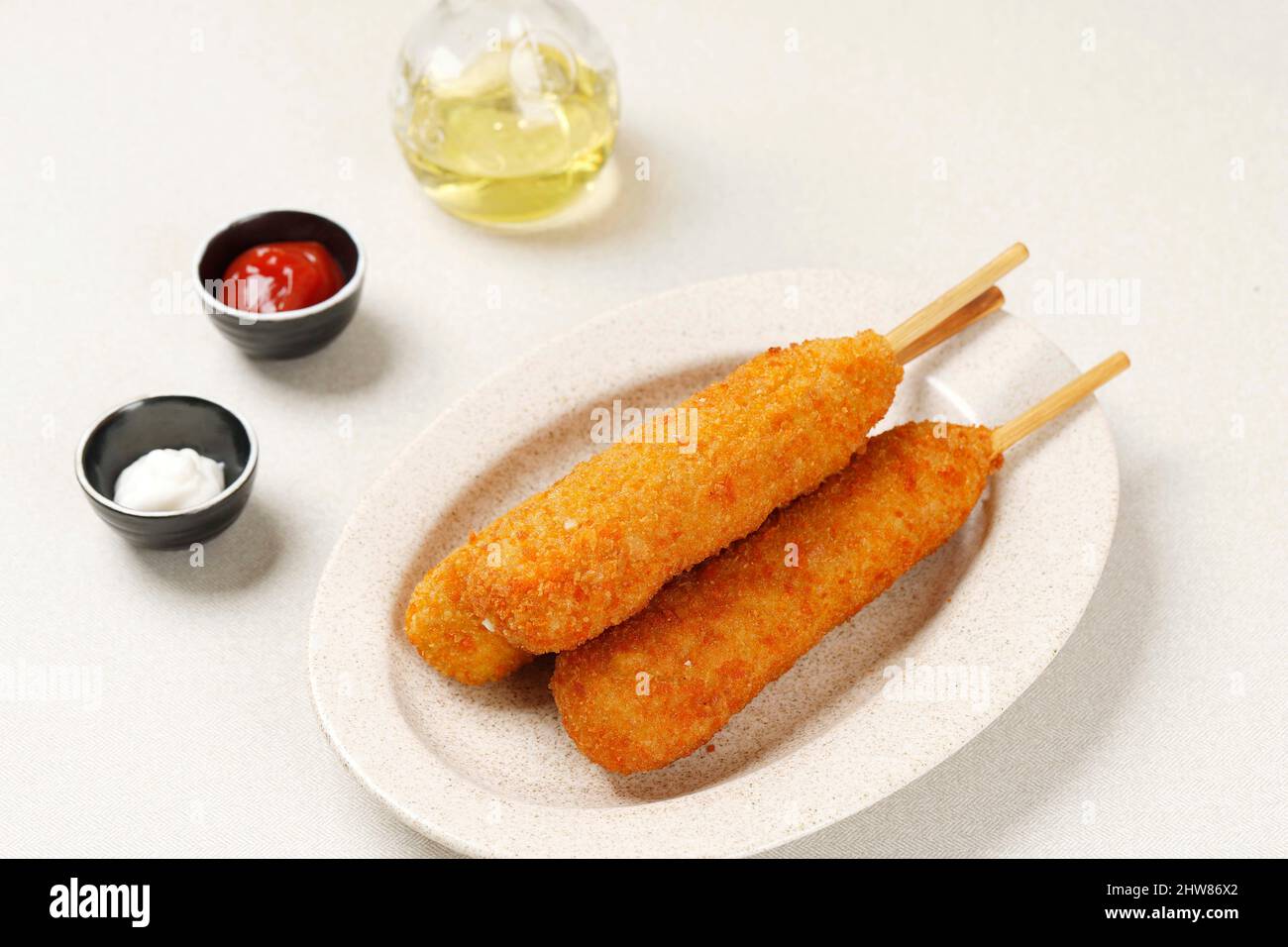 Organic Corn Dog on Stick with Ketchup and Mayonaise Stock Photo - Alamy