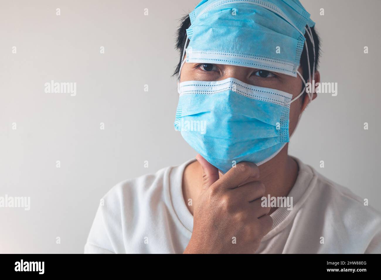 Medical masks wearing in correct way. But he uses them redundantly ...