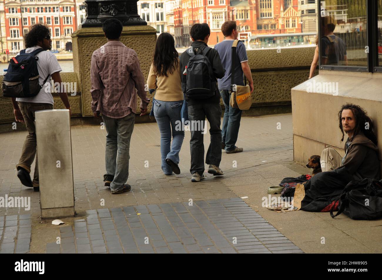 People ignoring a homeless man begging on a pavement. London, UK Stock ...