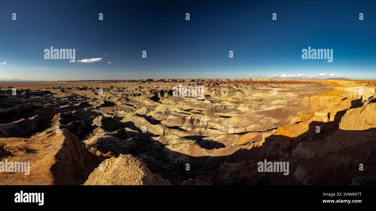 The Badlands of Arizona in late afternoon light and clear blue skies ...