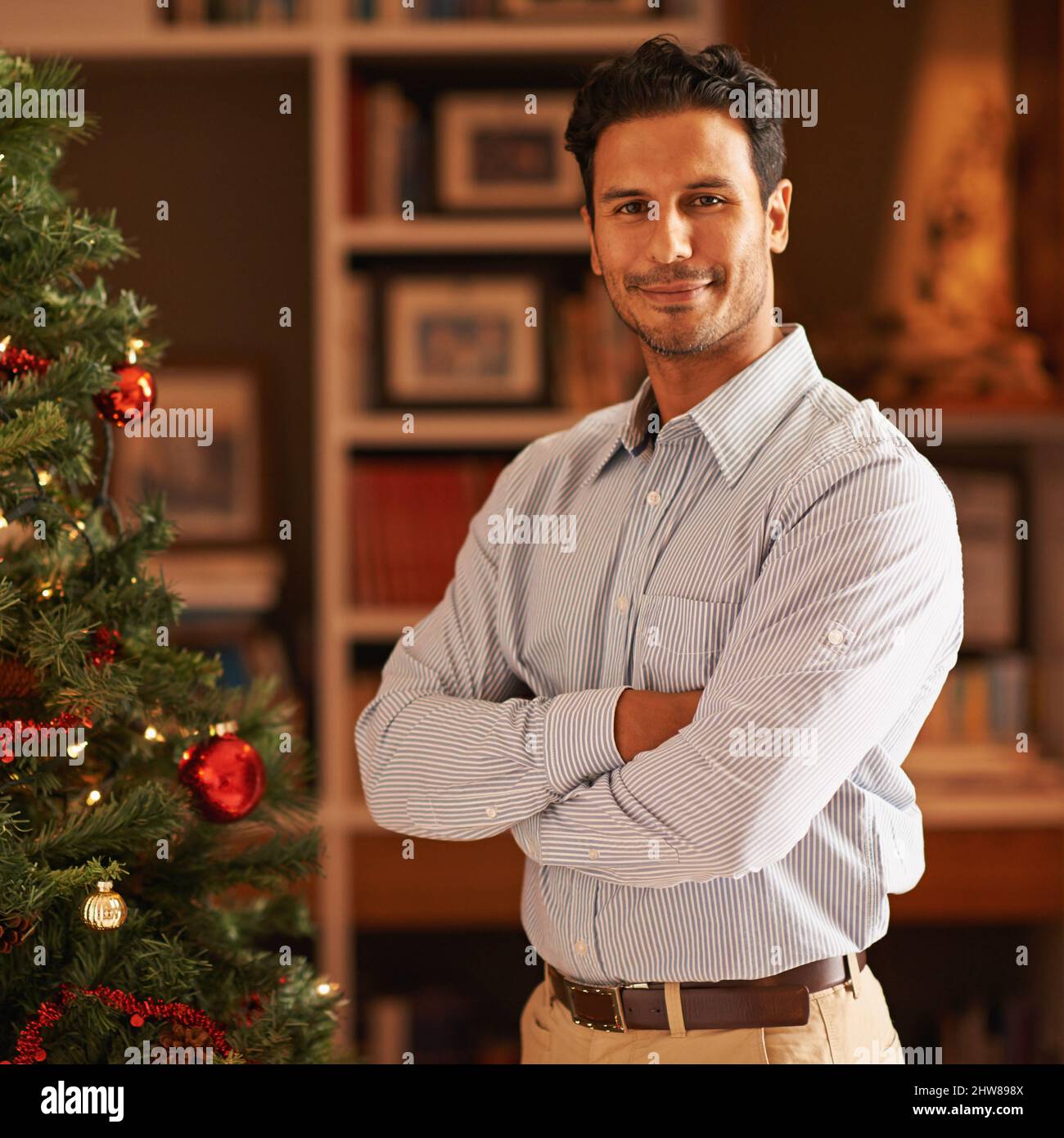 Standing next to christmas tree hi-res stock photography and images - Alamy