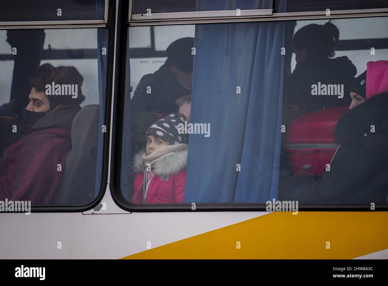 Korczowa, Poland. 04th Mar, 2022. Refugees on a bus pass the border ...