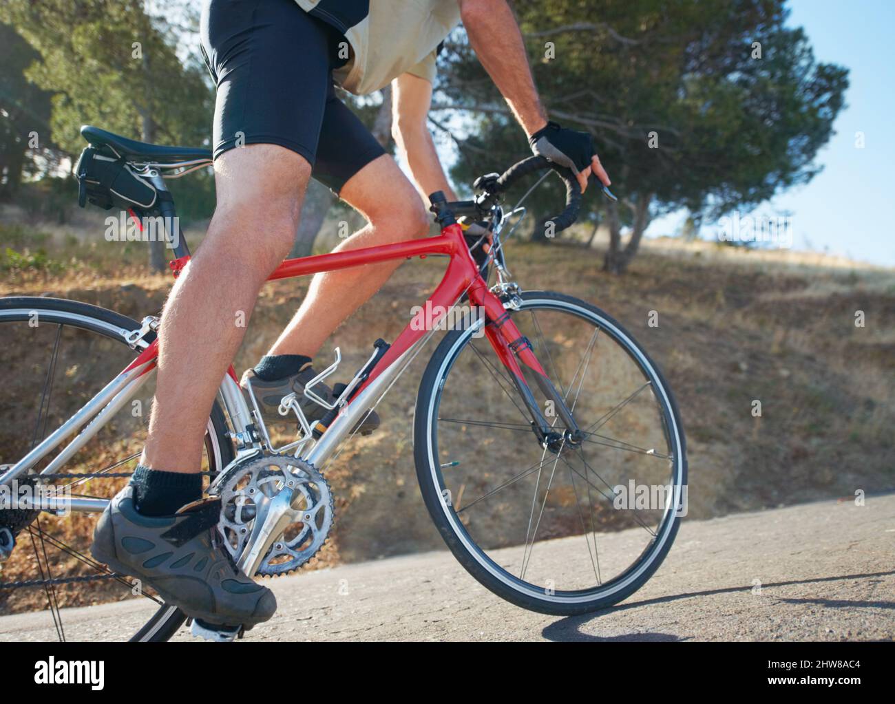 Person riding bike uphill hi-res stock photography and images - Alamy