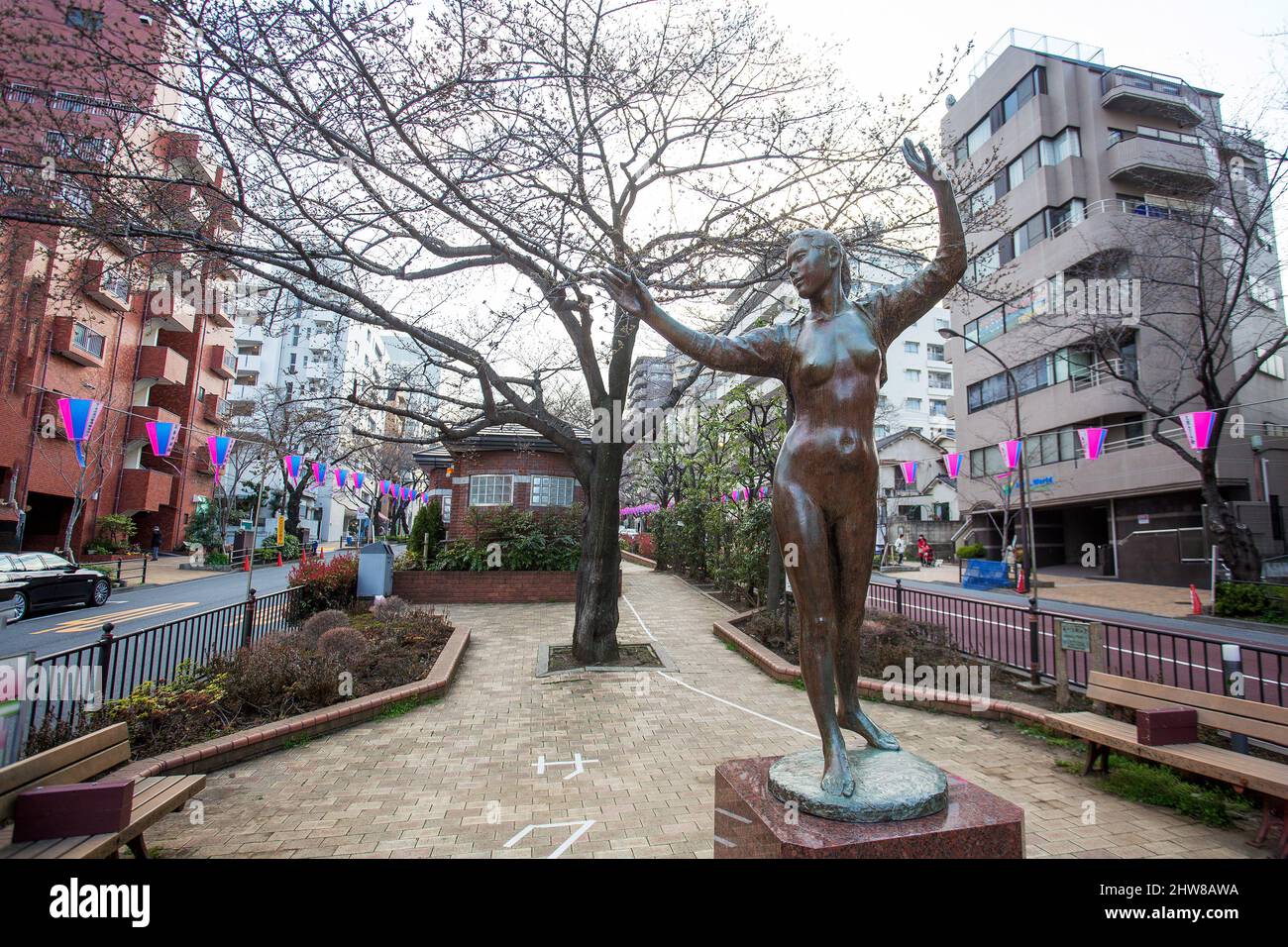 03--21-2015 Tokyo . Harimazaka Sakura-namiki (cherry alley) and statue ...