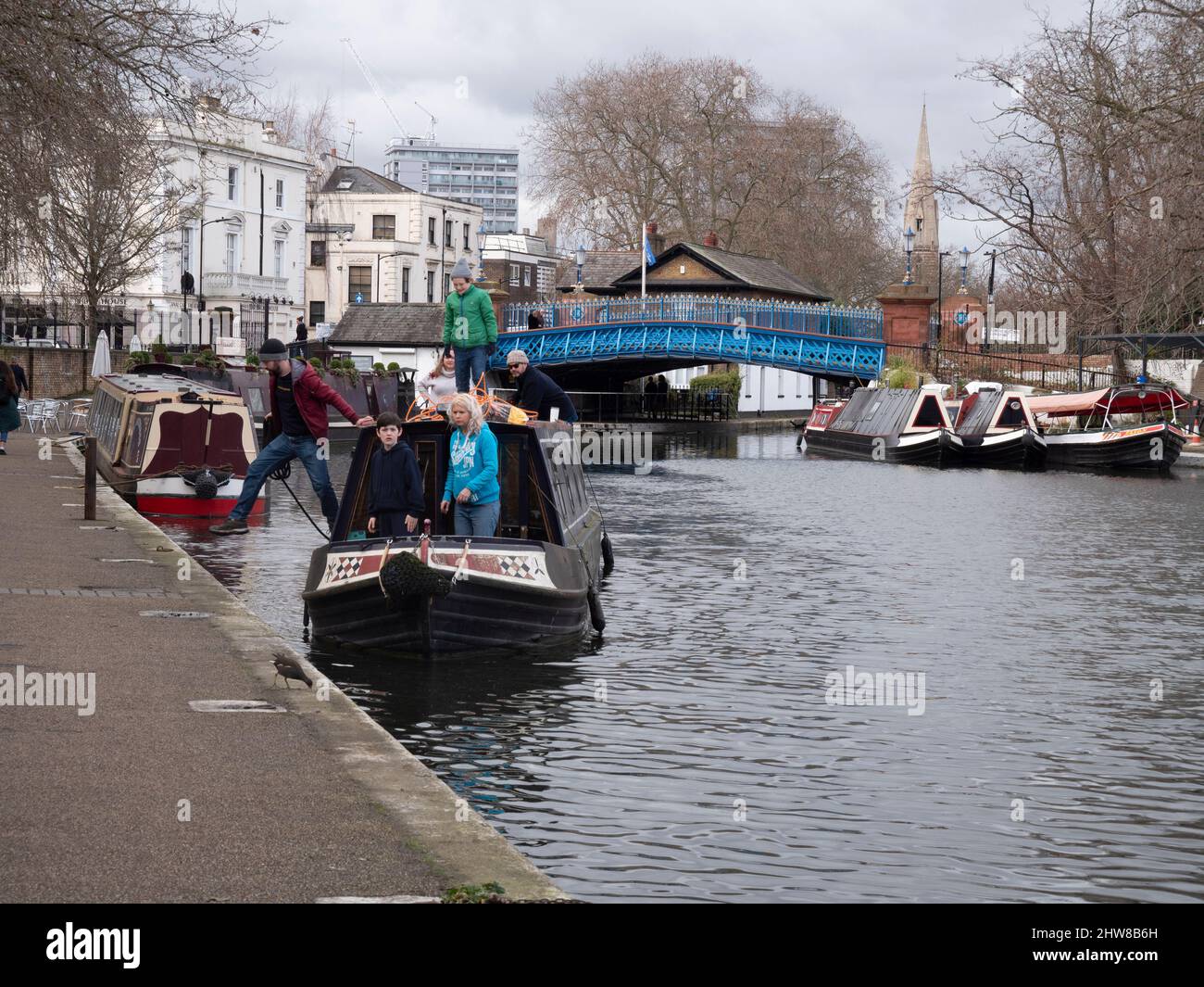 man holding rope jumping from Narrowboat, Barge, canal boat docking ...