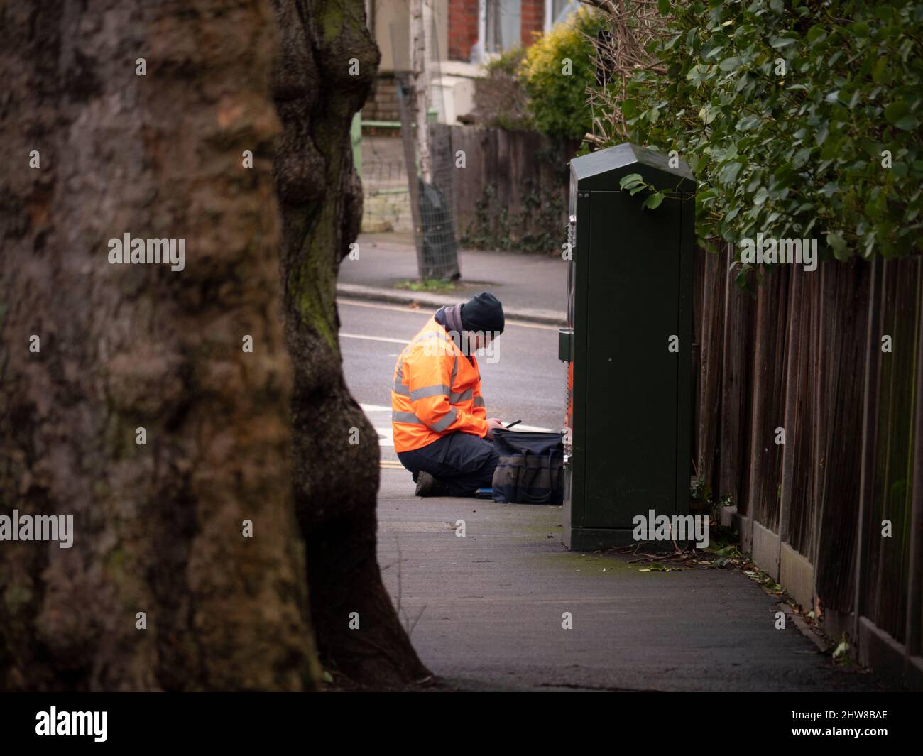 Openreach BT engineer working on street telecommunications cabinet ...