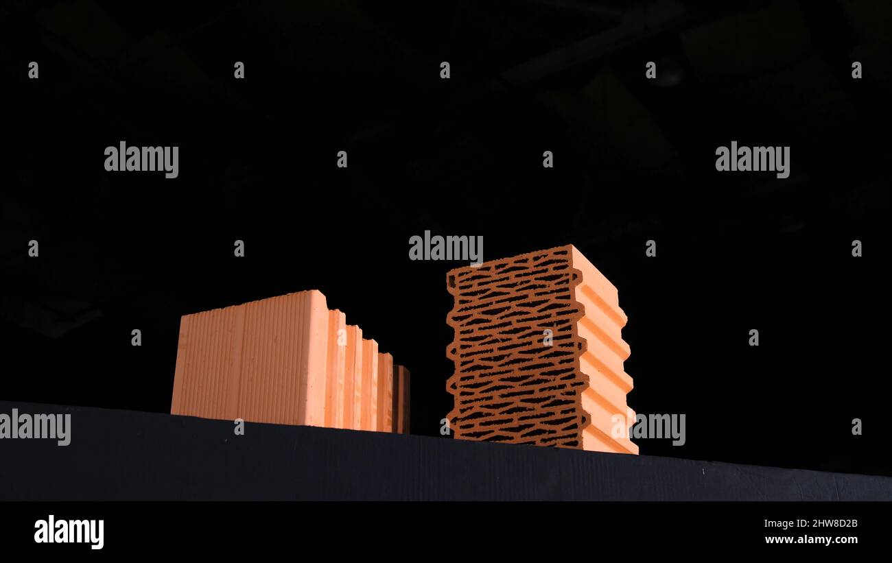 Close-up of two red bricks on black background. Stock footage ...