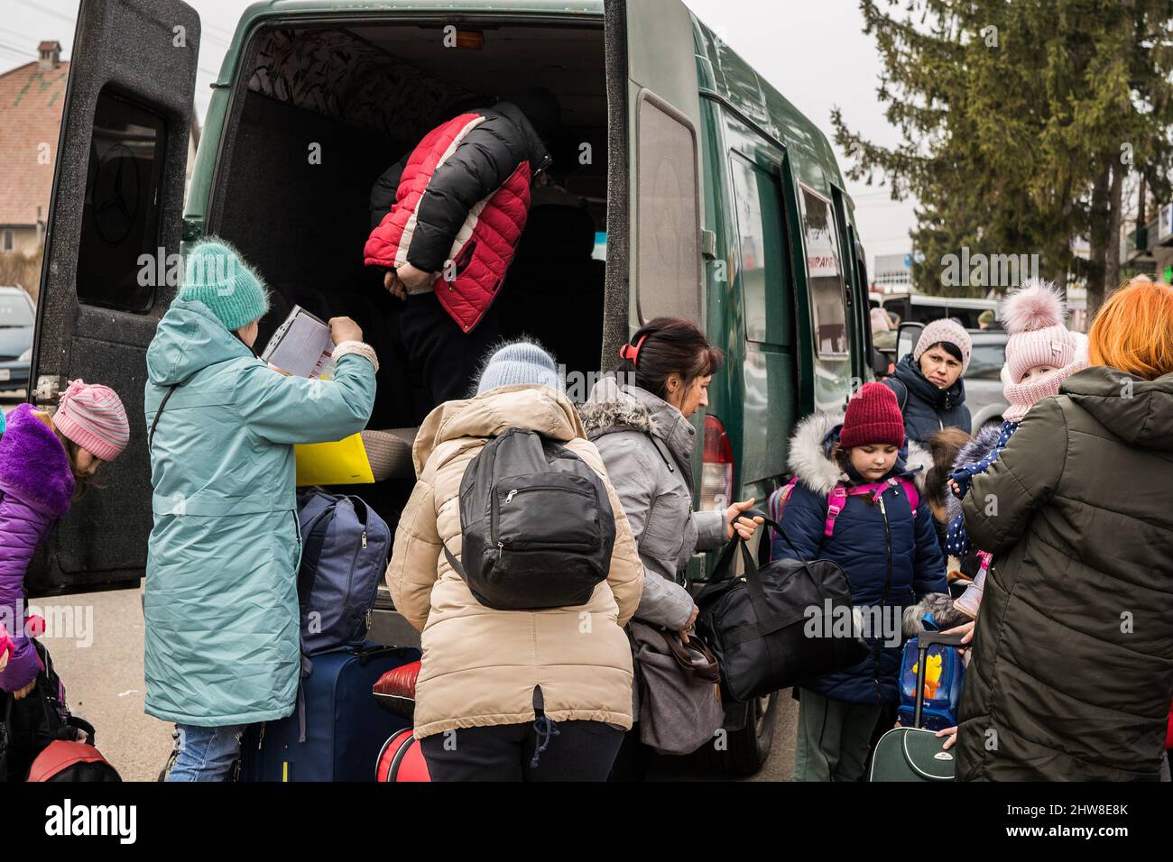 People arrived by mini bus from eastern Ukraine to Shehyni, Ukraine on ...
