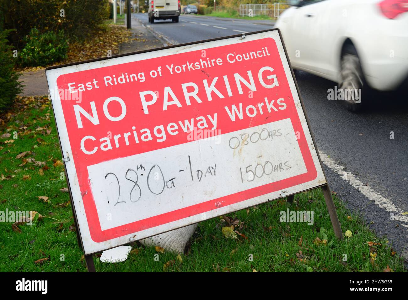 traffic passing no parking warning sign of roadworks bubwith yorkshire ...