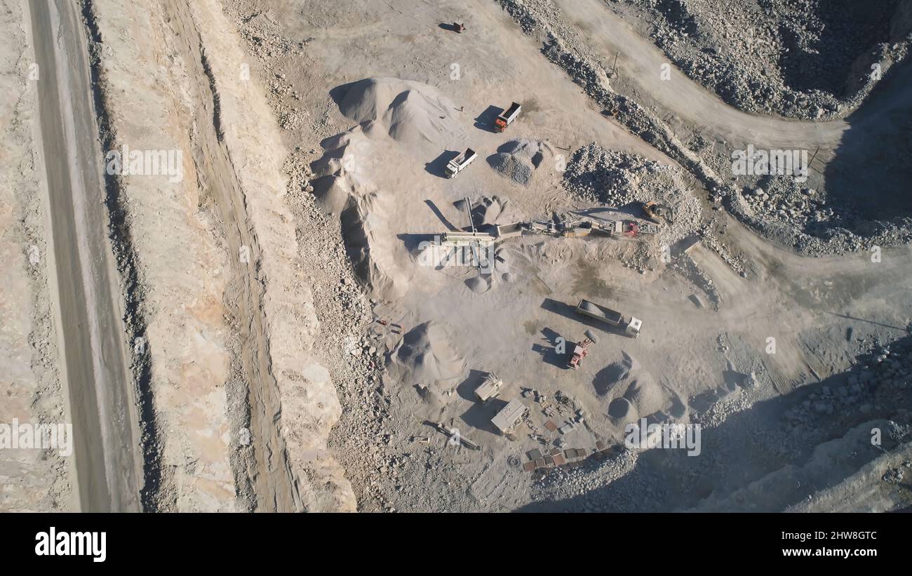 Top view of sand quarry with excavators. Shot. Open pit mining ...