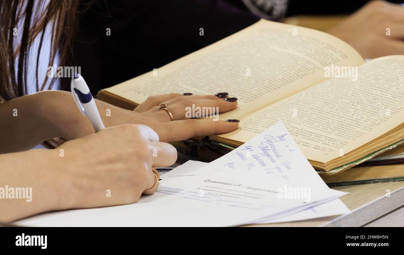 School student's taking exam writing answer in classroom for education ...
