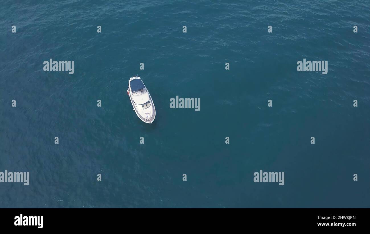 Top view of alone yacht floating in turquoise water. Clip. Yacht ...