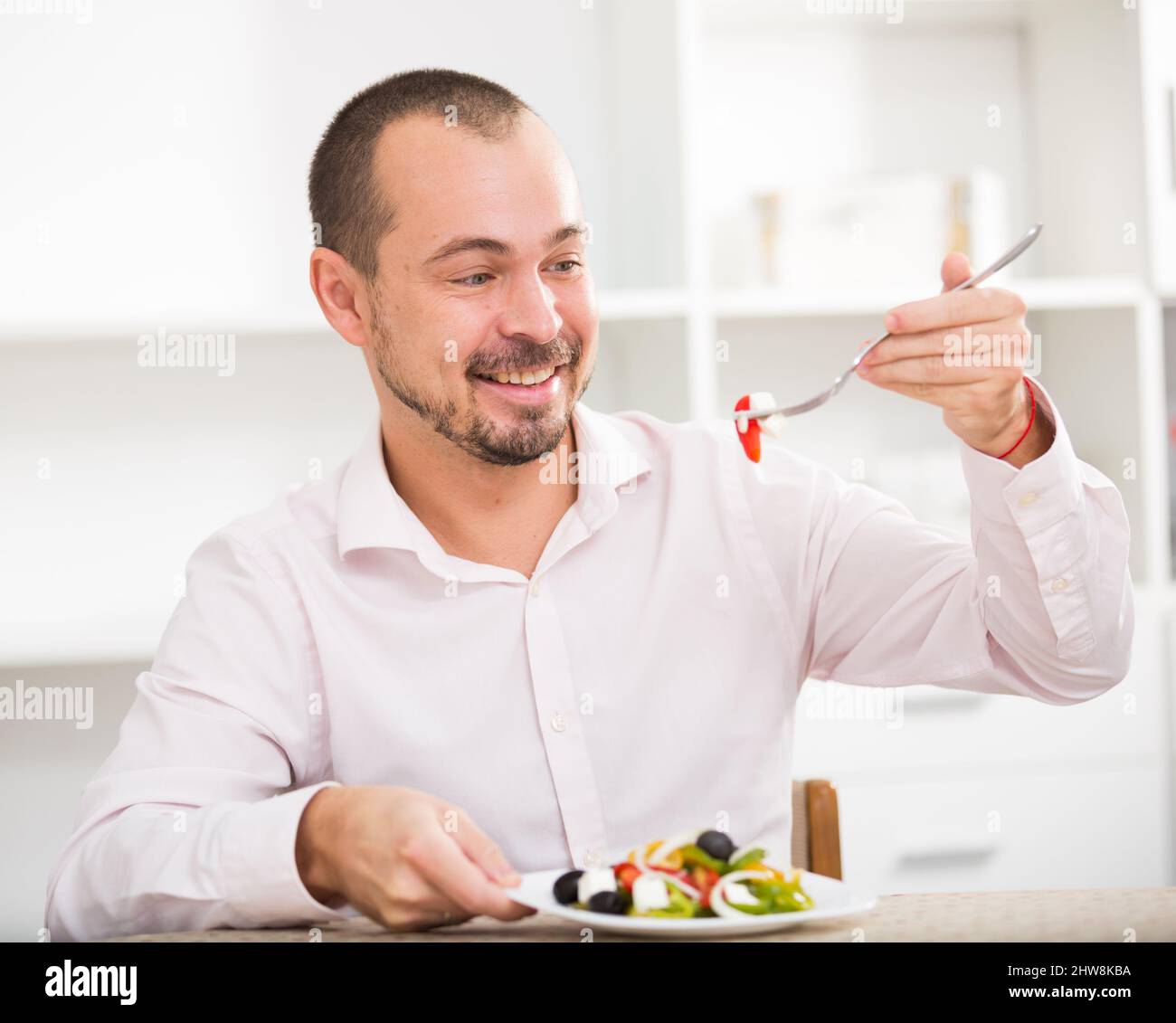 Smiling man looking greek hi-res stock photography and images - Alamy