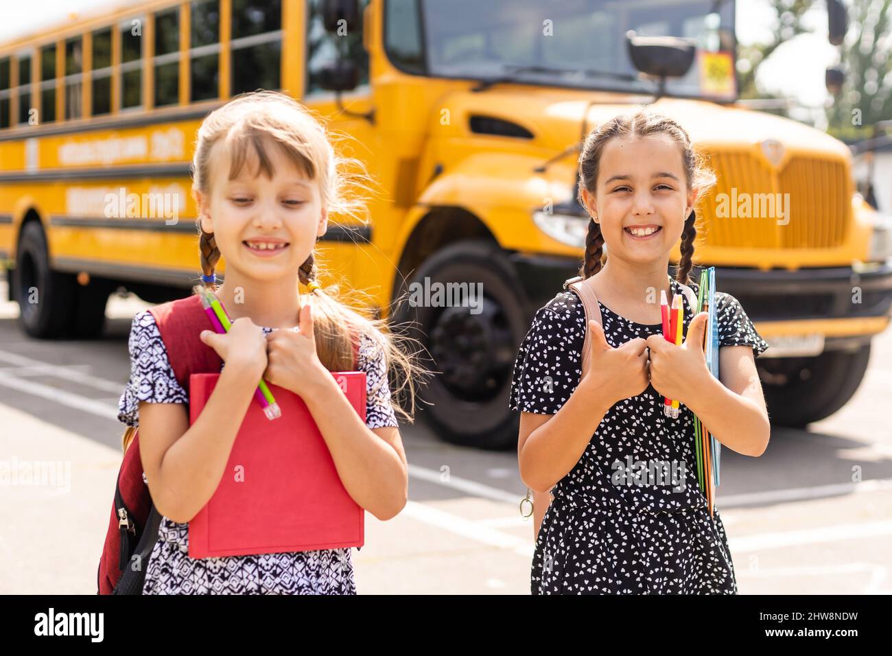 Basic school students crossing the road Stock Photo - Alamy