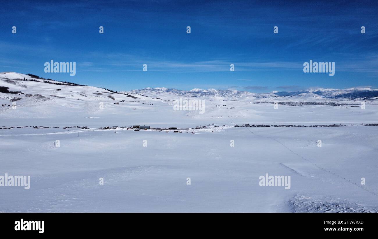 Aerial view of a field covered in snow in the countryside Stock Photo ...